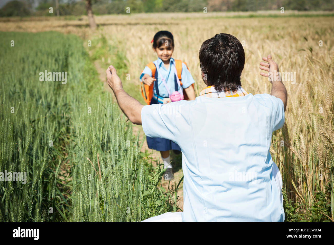 Farmer about to hug his daughter in the field, Sohna, Haryana, India Stock Photo - Alamy