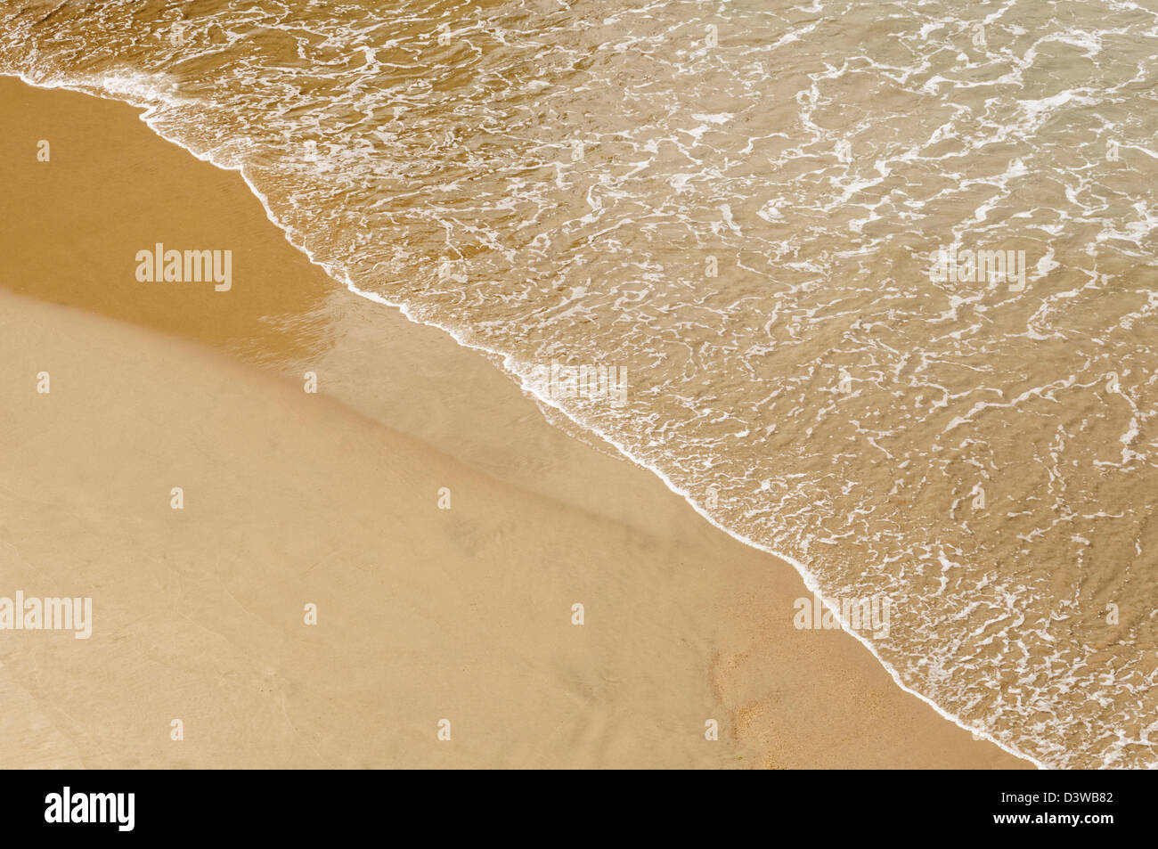 Sand beach and sea water Stock Photo - Alamy