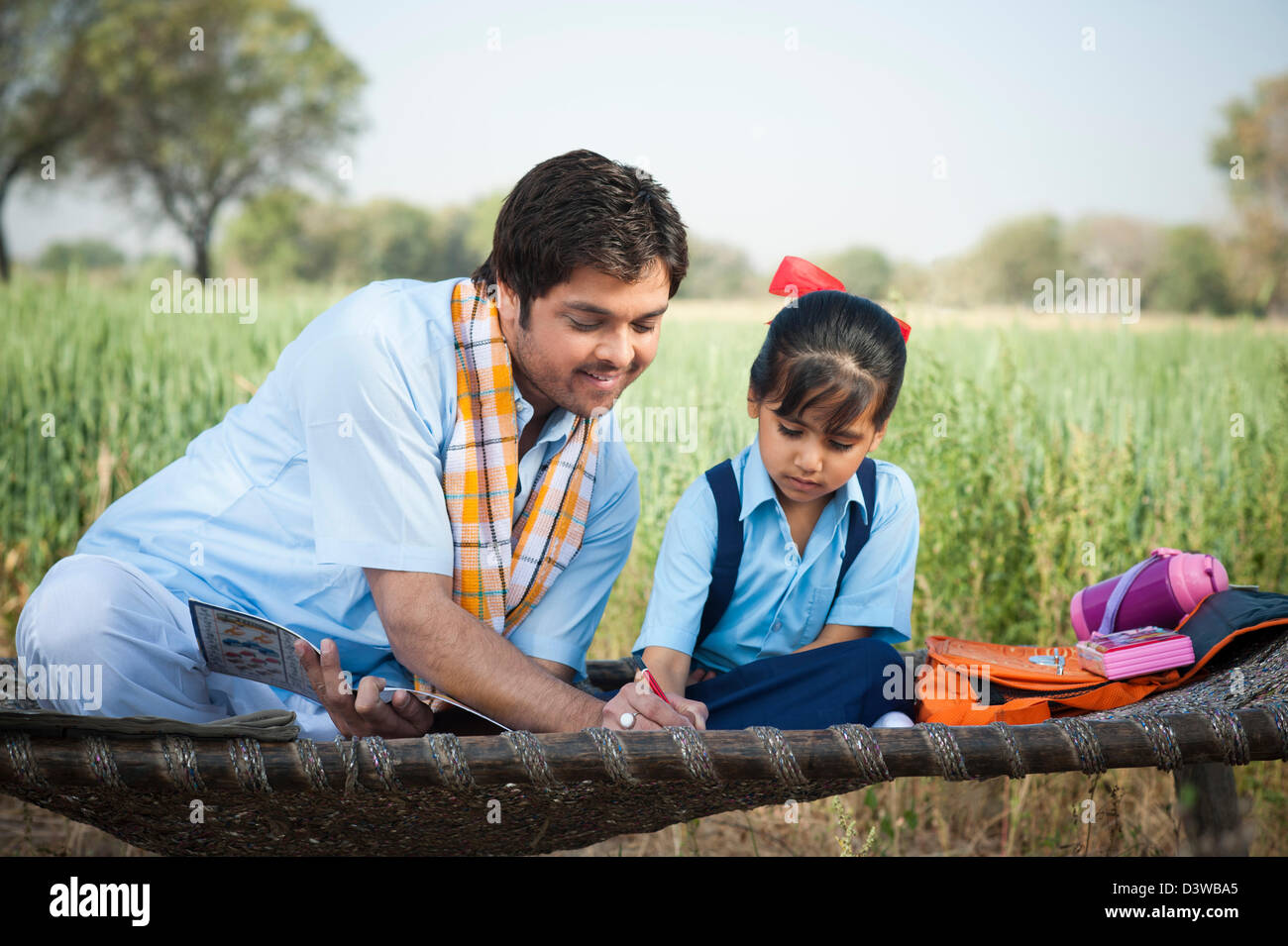 Farmer teaching his daughter in the field, Sohna, Haryana, India Stock Photo - Alamy