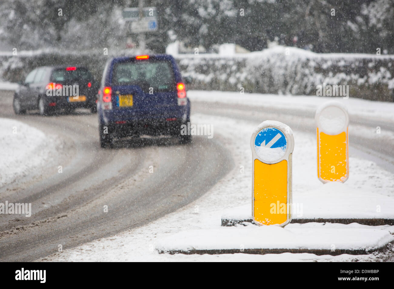 Cars driving through heavy snow in Ambleside, Lake District, UK Stock ...