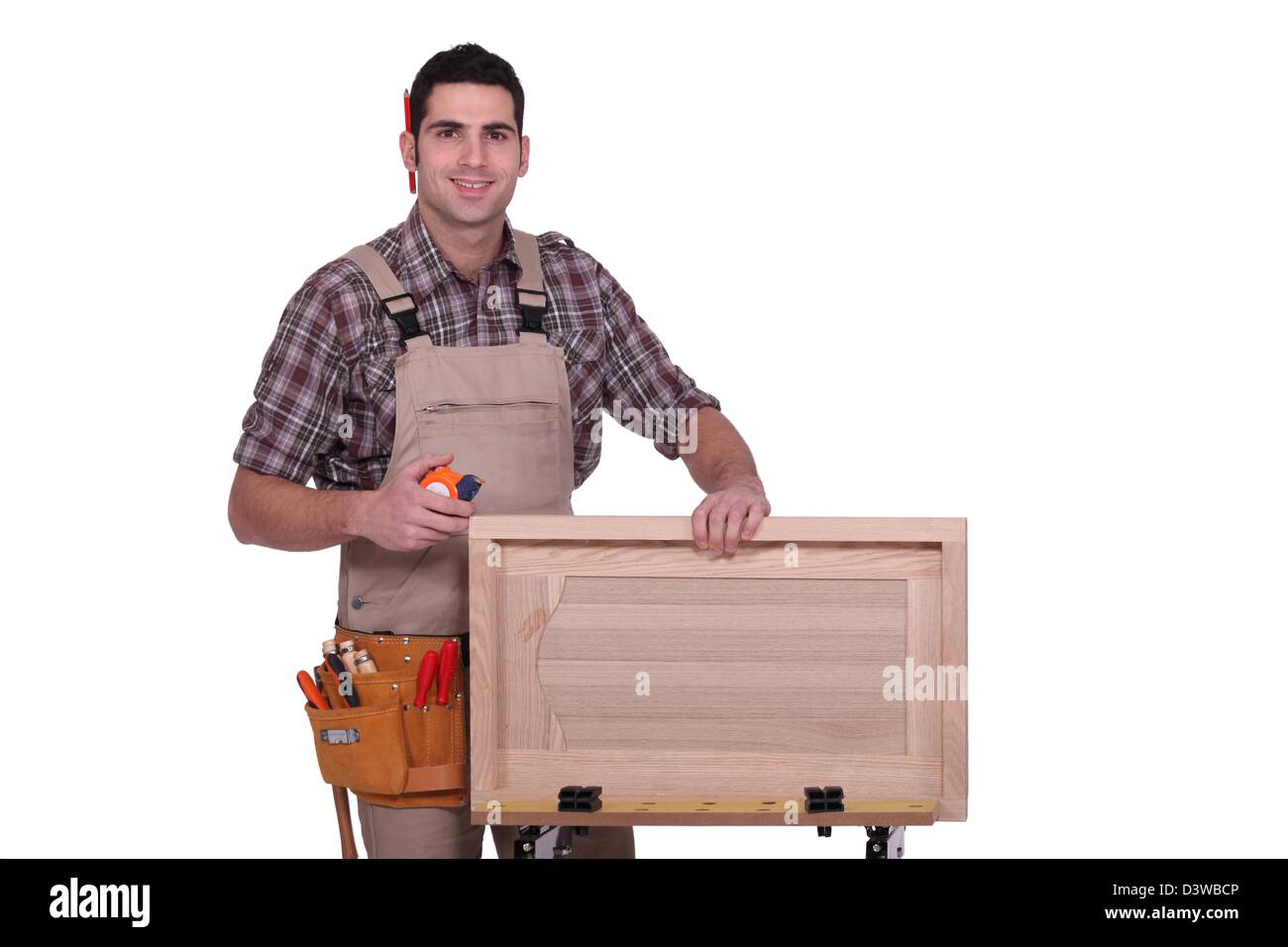 Man measuring cabinet door Stock Photo - Alamy