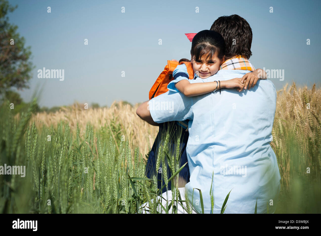 Farmer hugging his daughter in the field, Sohna, Haryana, India Stock ...