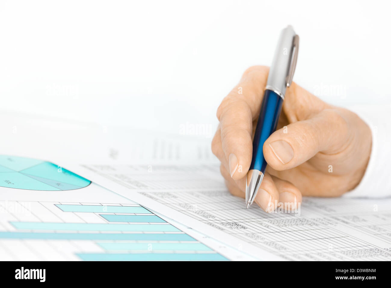 Analyzing Figures on Spreadsheet Stock Photo - Alamy