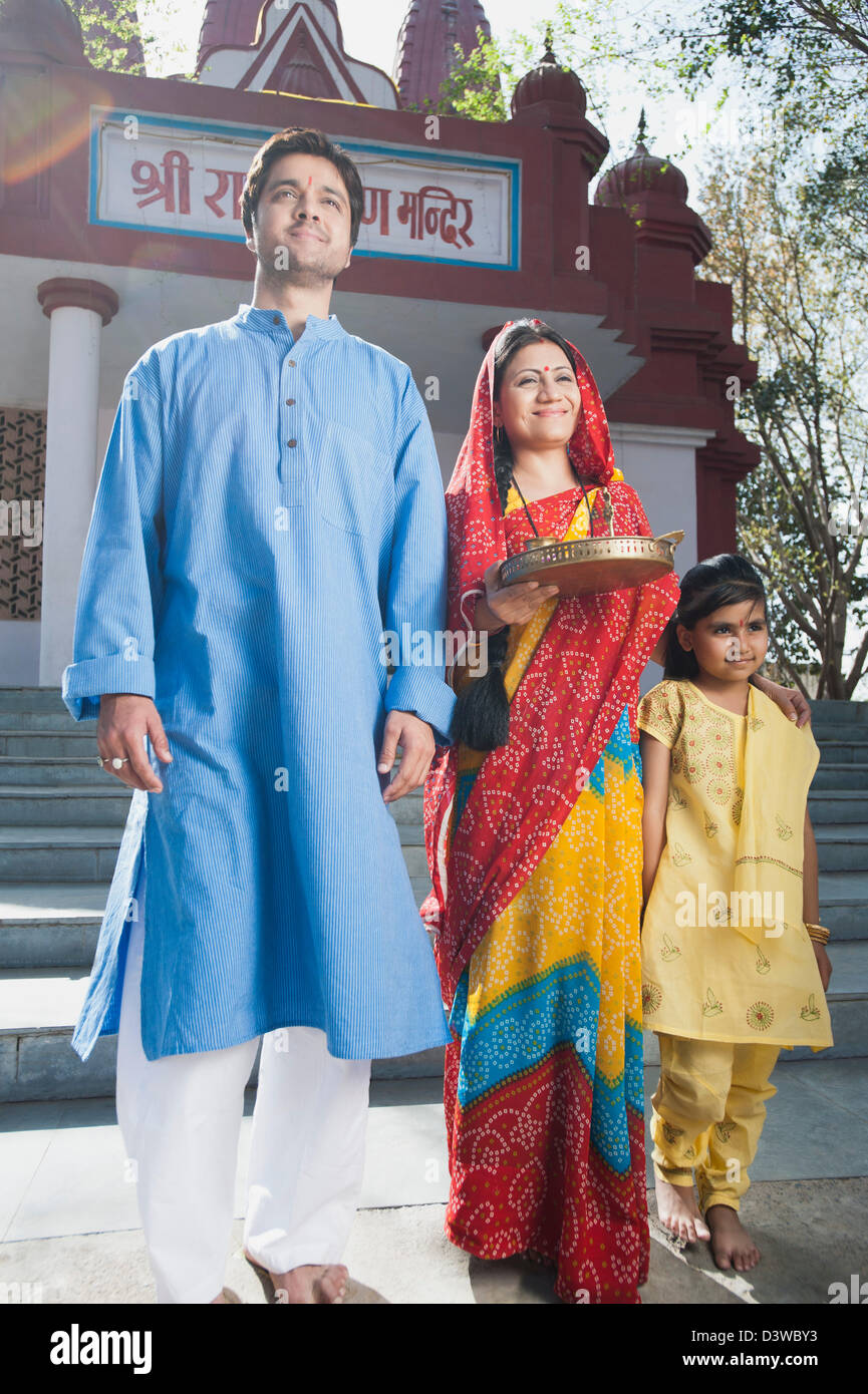 Rural family standing in front of a temple, Sohna, Haryana, India Stock ...