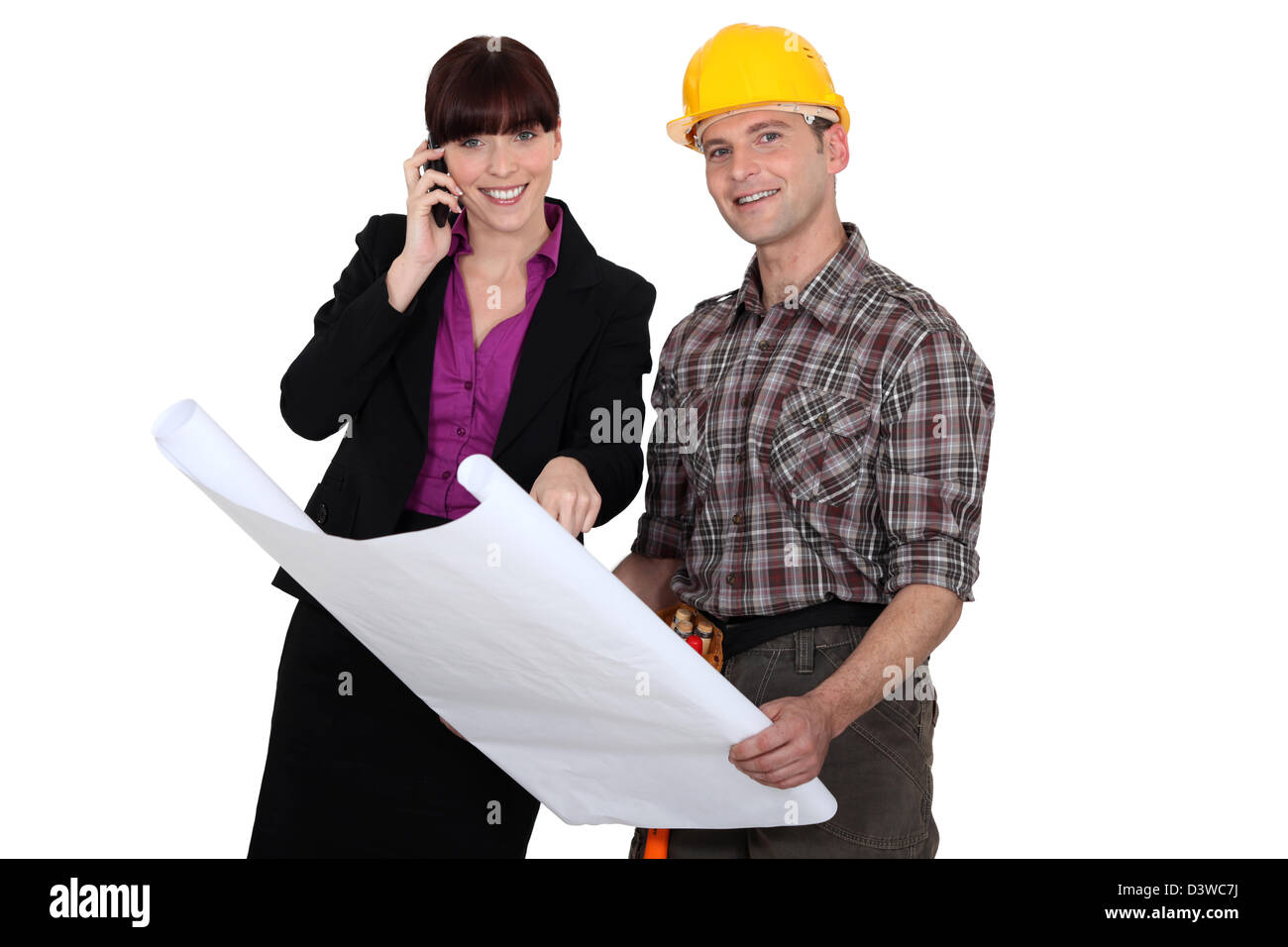 Colleagues looking at design plans Stock Photo - Alamy