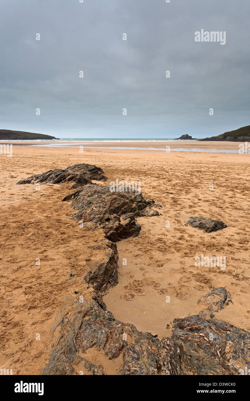A rock formation in the sand at Crantock beack in Cornwall, England ...