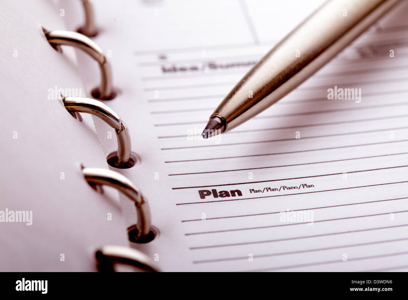 The word plan and pen closeup in organizer Stock Photo - Alamy