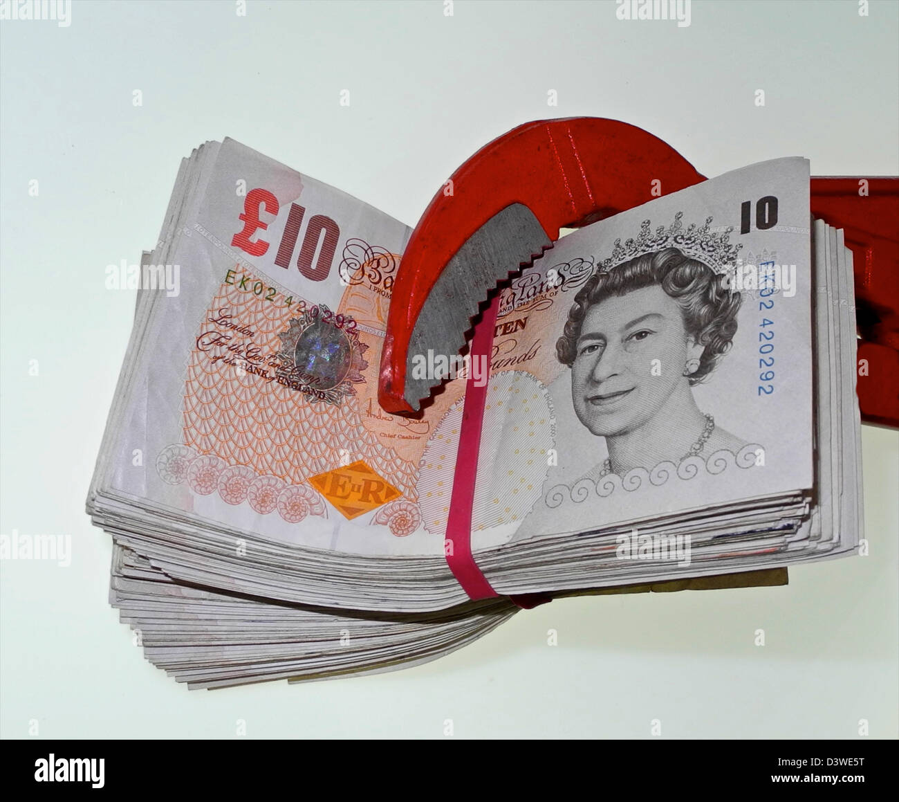 The Squeezed Pound Sterling Under Pressure money crisis Stock Photo - Alamy