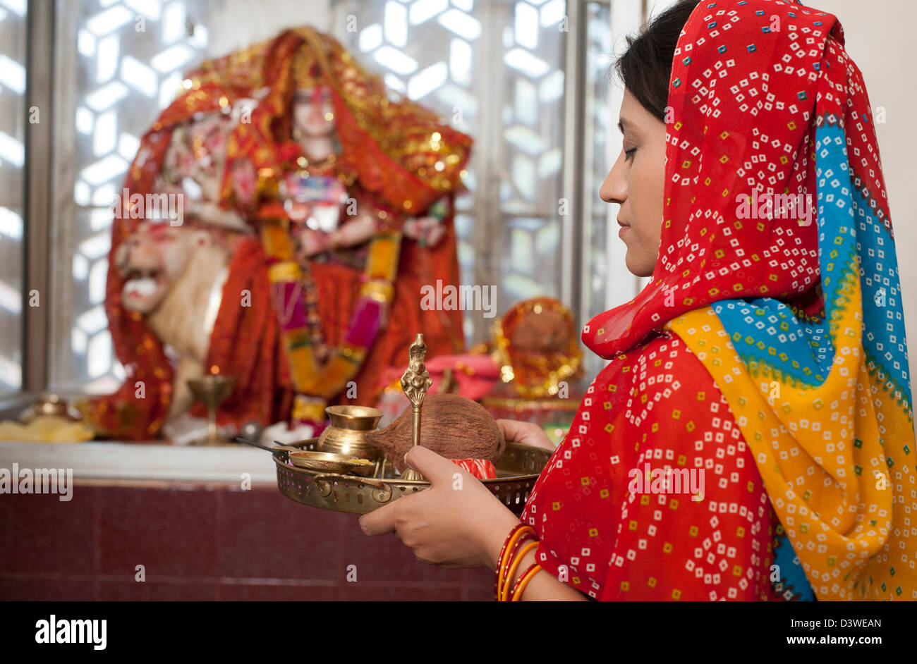 Woman praying in a temple, Sohna, Haryana, India Stock Photo - Alamy