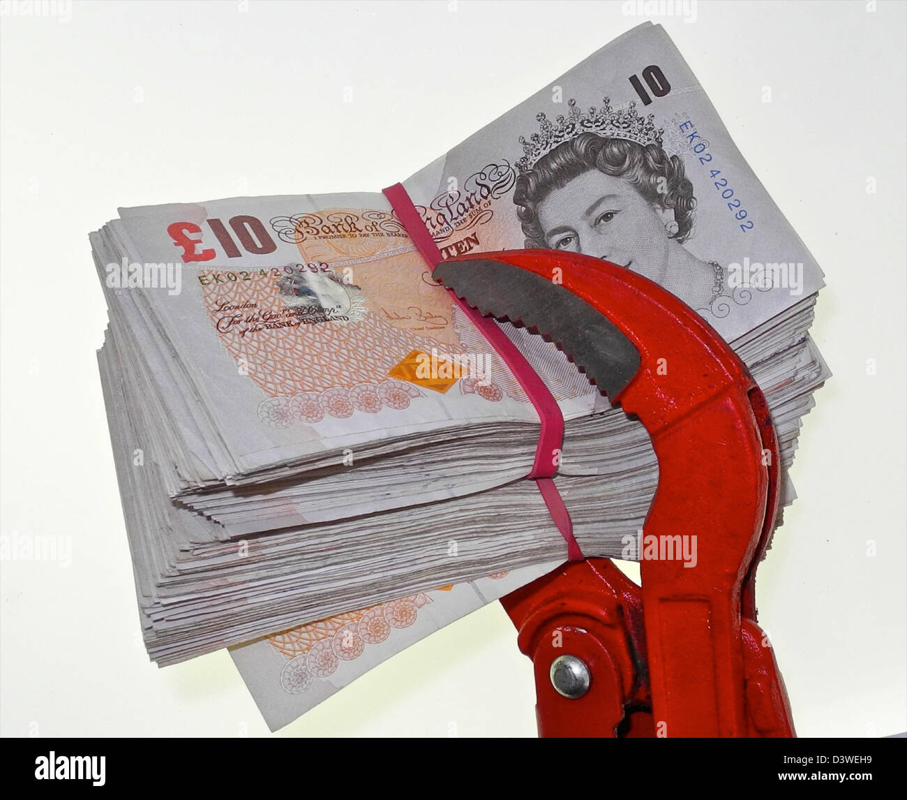 The Squeezed Pound Sterling Under Pressure money crisis Stock Photo - Alamy
