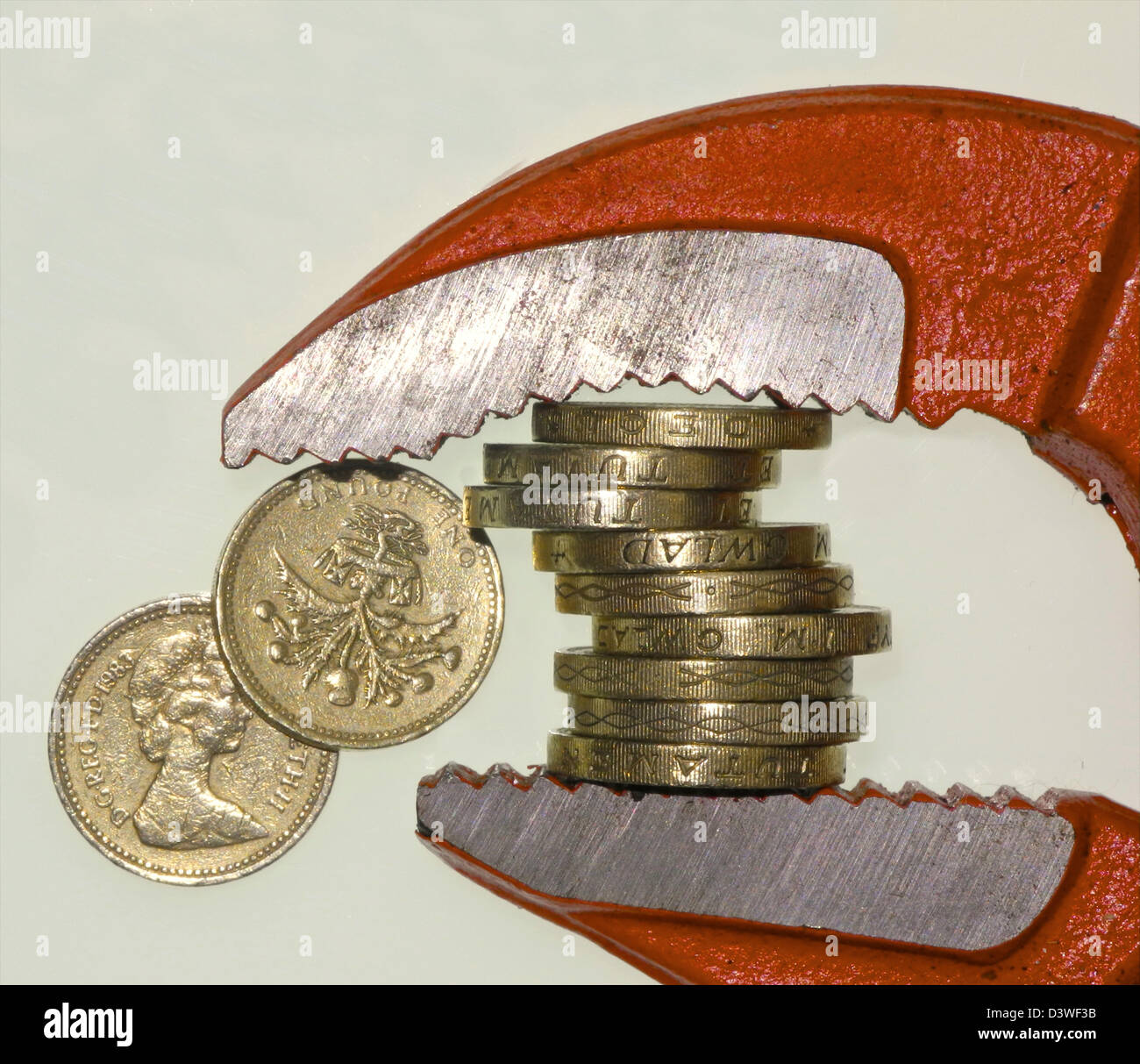 The Squeezed Pound Sterling Under Pressure money crisis Stock Photo - Alamy