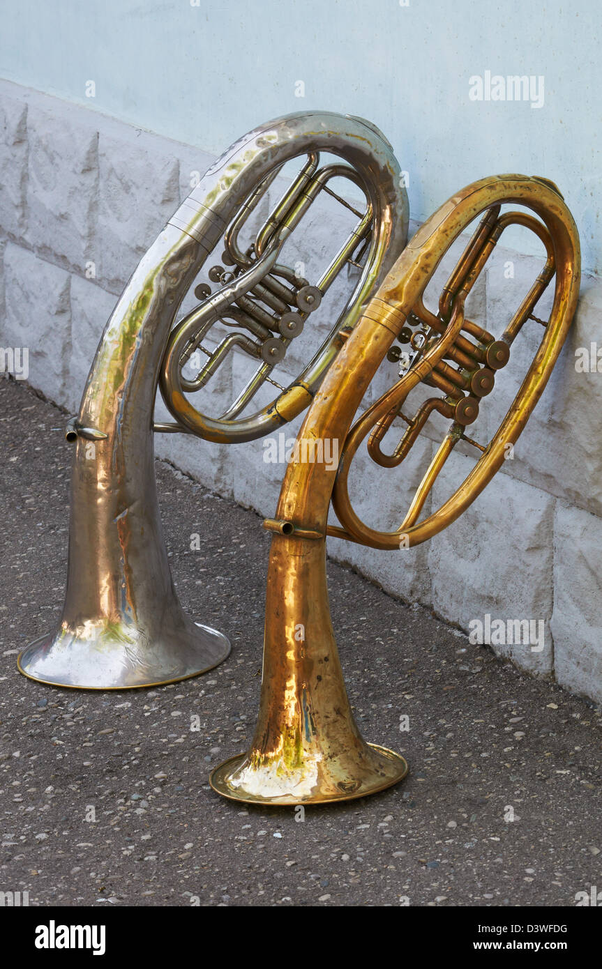 Two old trumpets stand at a wall Stock Photo - Alamy