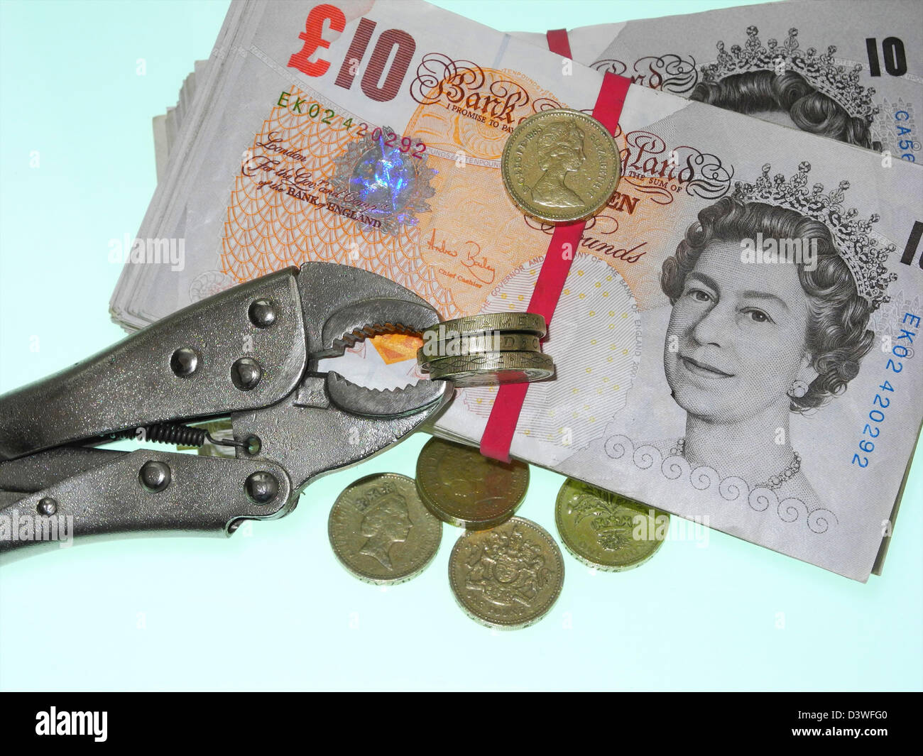 The Squeezed Pound Sterling Under Pressure money crisis Stock Photo - Alamy