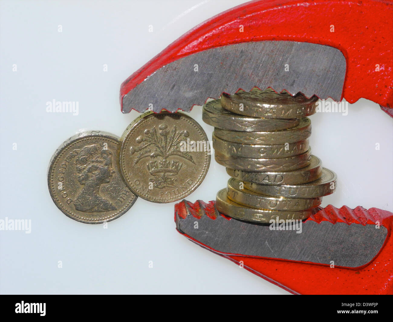 The Squeezed Pound Sterling Under Pressure money crisis Stock Photo - Alamy