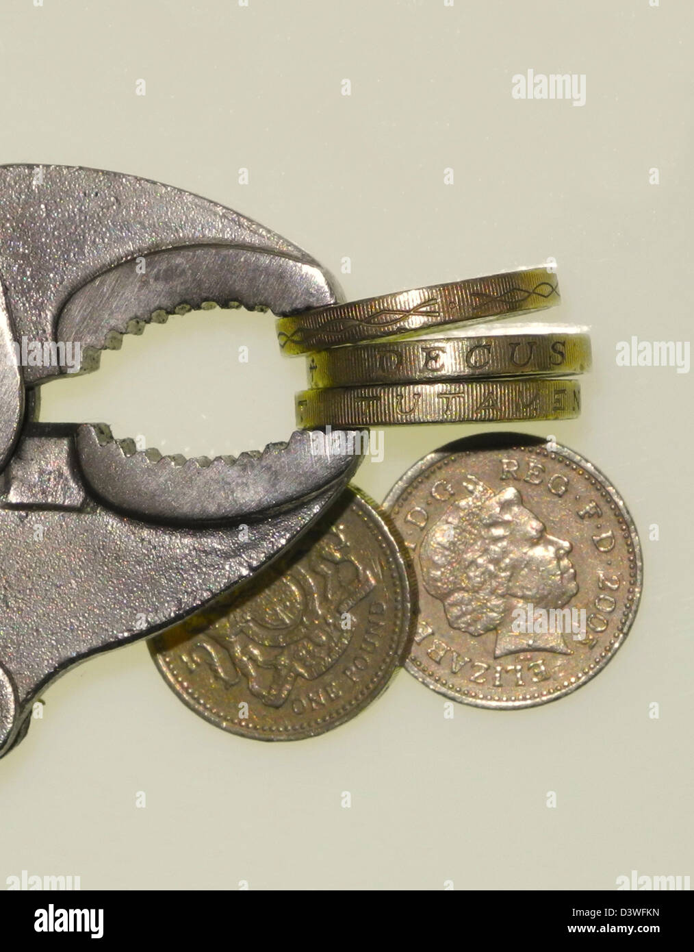 The Squeezed Pound Sterling Under Pressure money crisis Stock Photo - Alamy