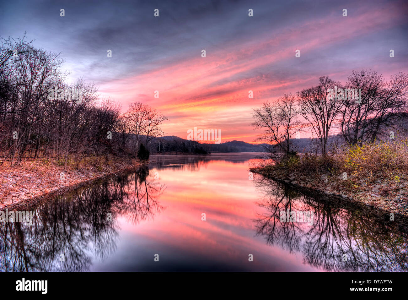 A beautiful sunrise over a lake Stock Photo - Alamy