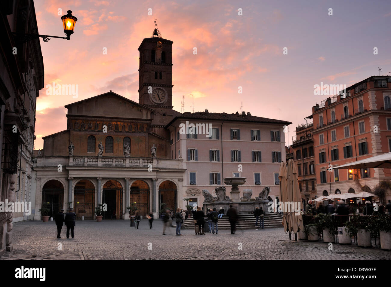 Italy, Rome, Piazza di Santa Maria in Trastevere at sunset Stock Photo ...