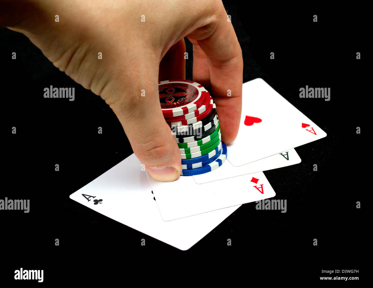 Cards and ultimate poker chips on black Stock Photo - Alamy