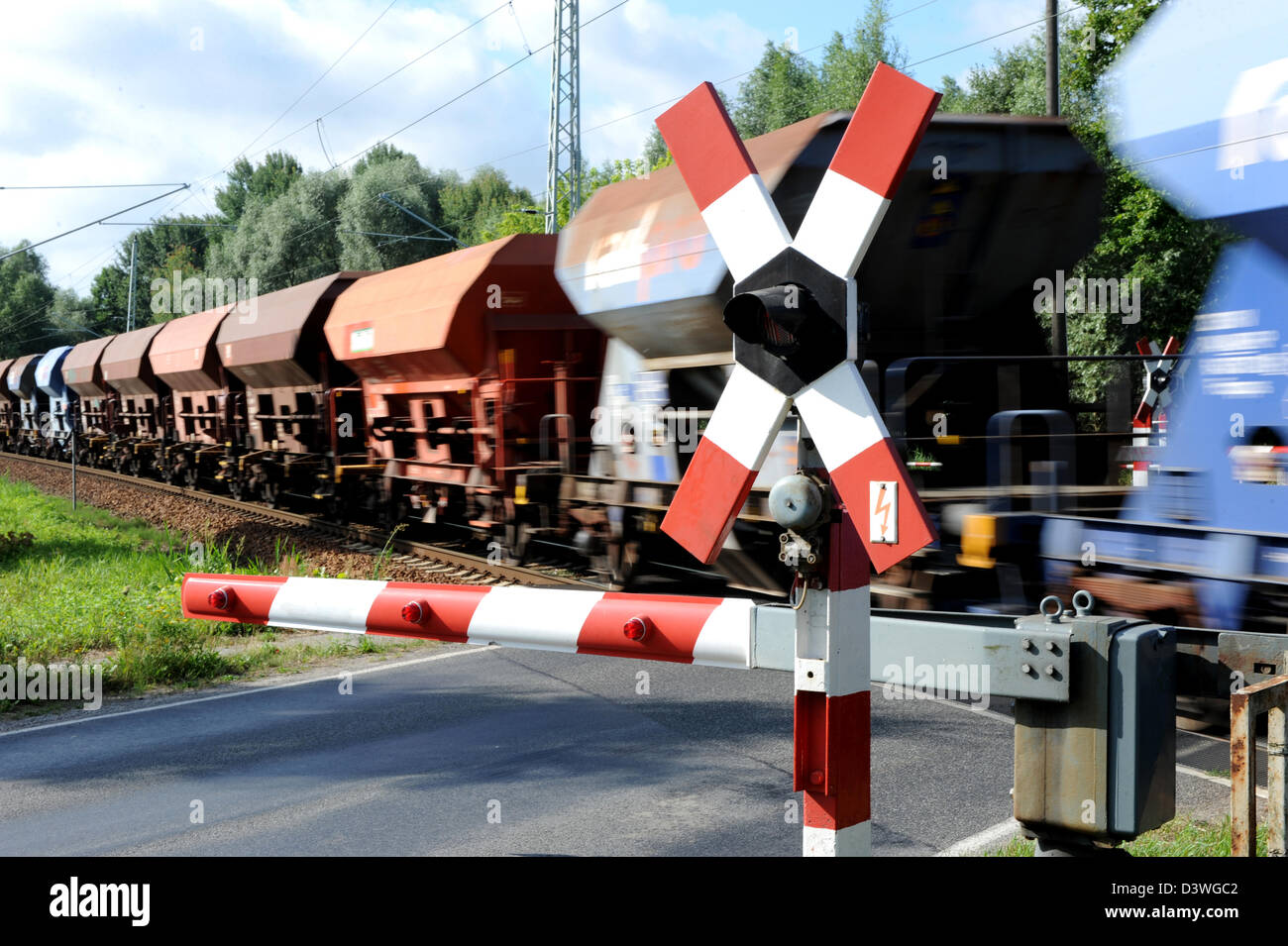 Zossen, Germany, a drive through freight train at a railroad crossing ...