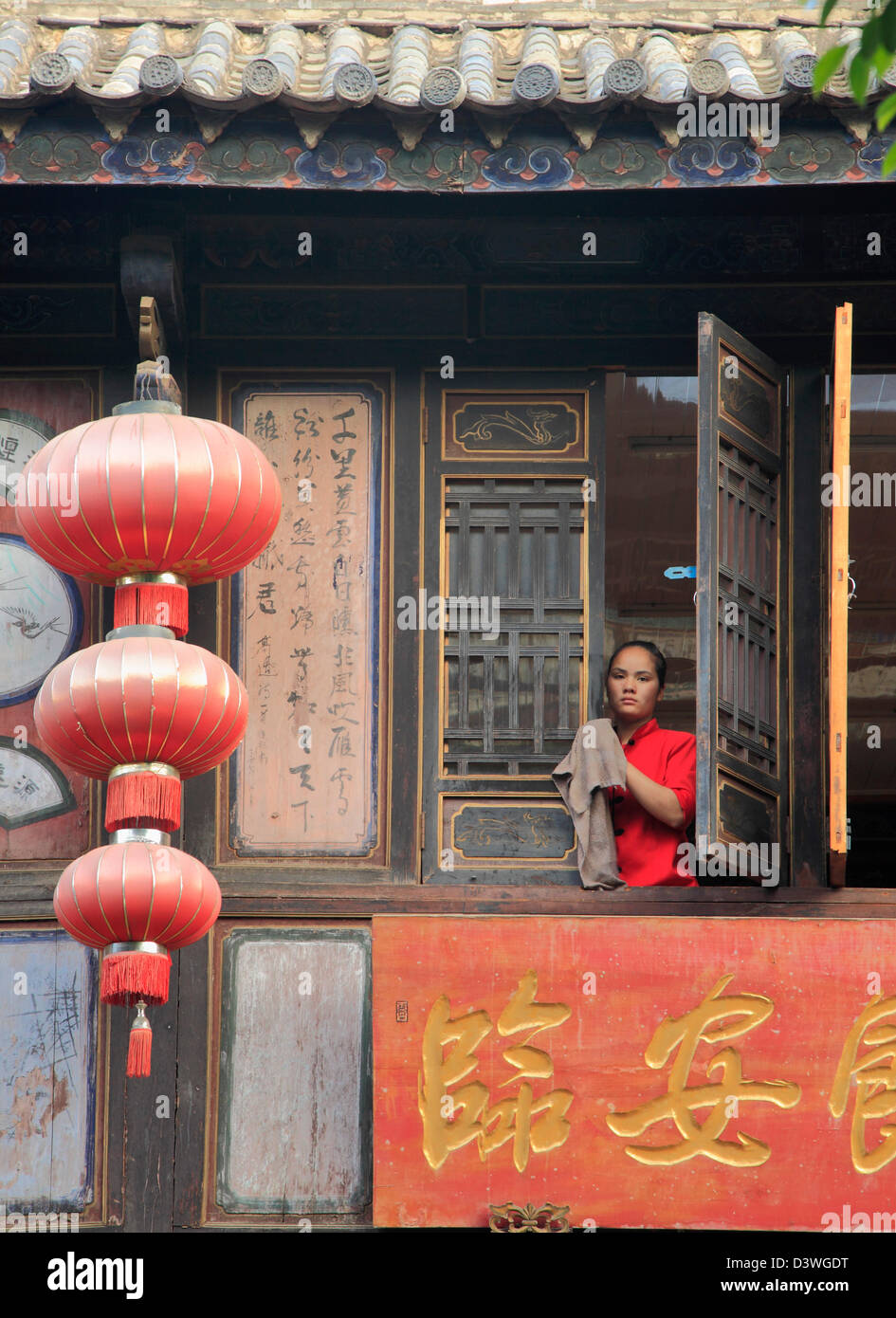 China, Yunnan, Jianshui, typical architecture, woman in a window ...