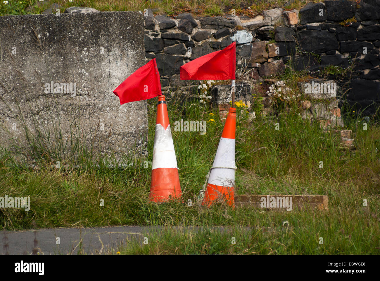 Traffic cones with red flags Stock Photo - Alamy