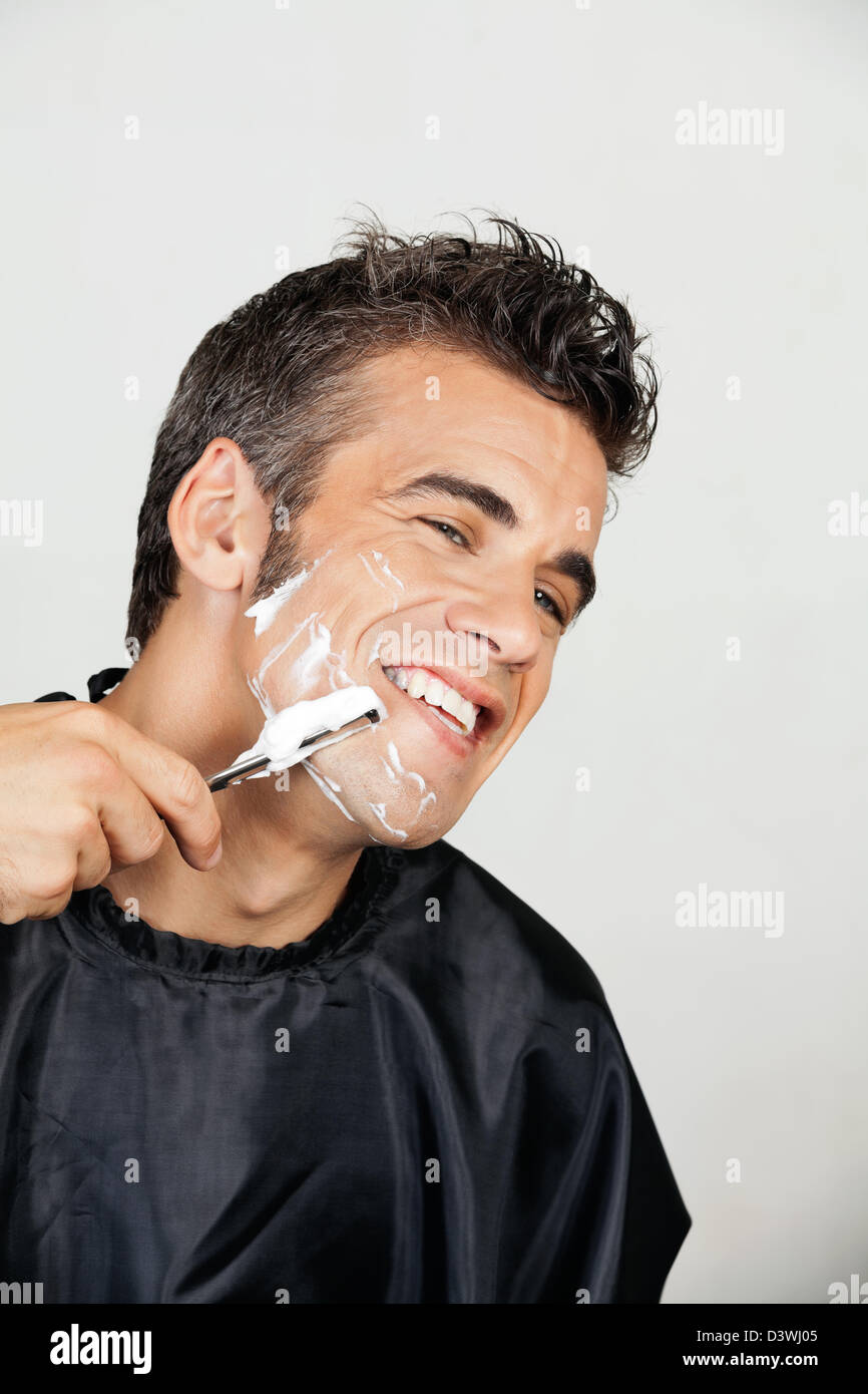 Happy Man Shaving His Face Stock Photo - Alamy