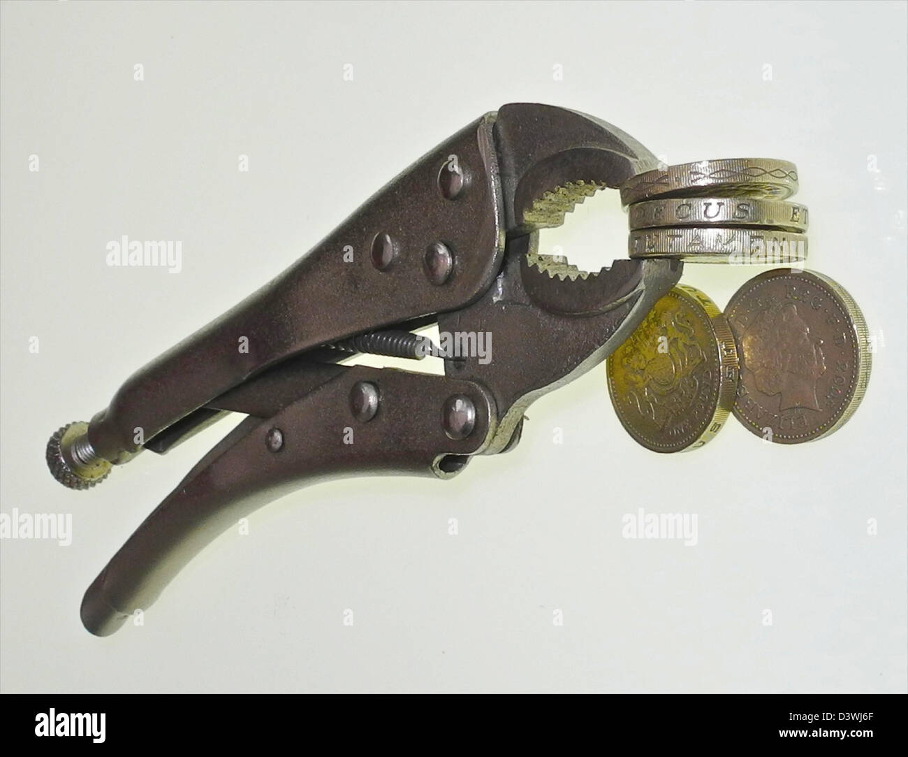 The Squeezed Pound Sterling Under Pressure money crisis Stock Photo - Alamy