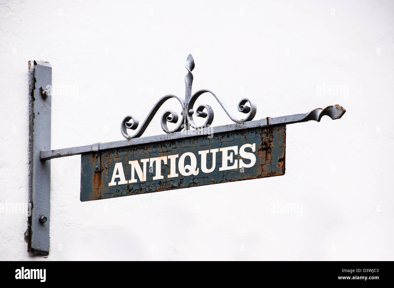 Old Vintage sign for Antiques on a metal pole Stock Photo - Alamy