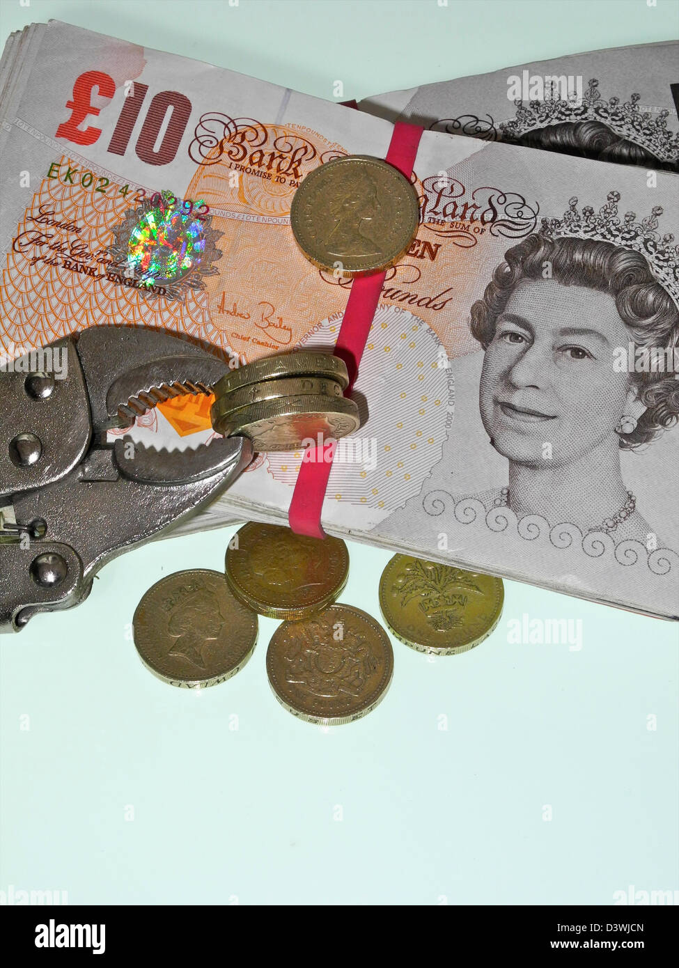 The Squeezed Pound Sterling Under Pressure money crisis Stock Photo - Alamy