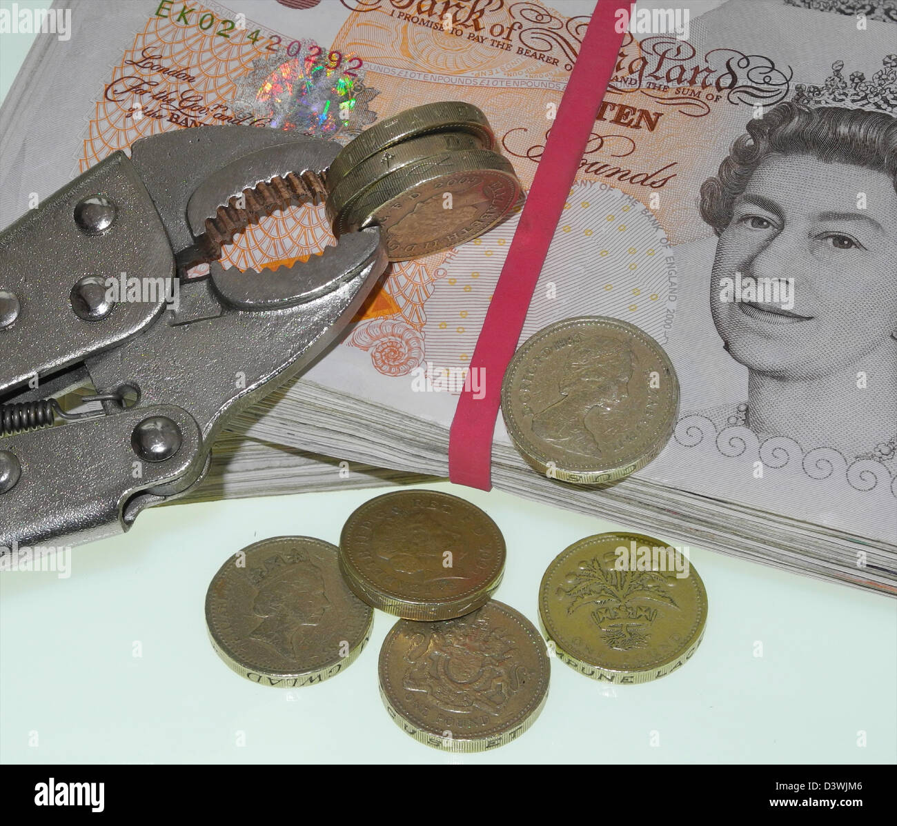 The Squeezed Pound Sterling Under Pressure money crisis Stock Photo - Alamy