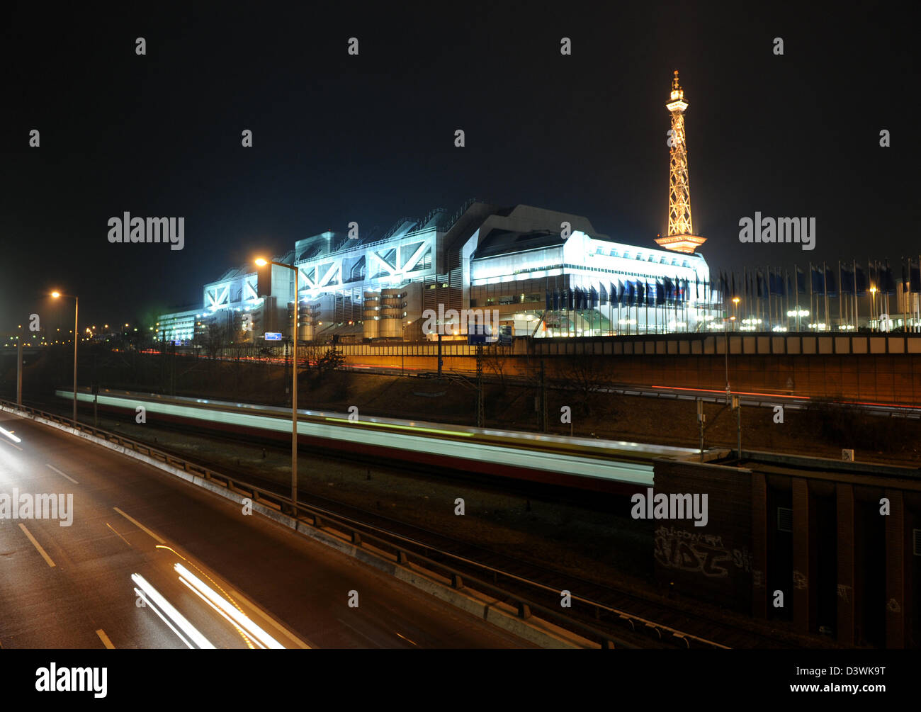 Berlin, Germany, the ICC and passing cars on the freeway at night Stock ...
