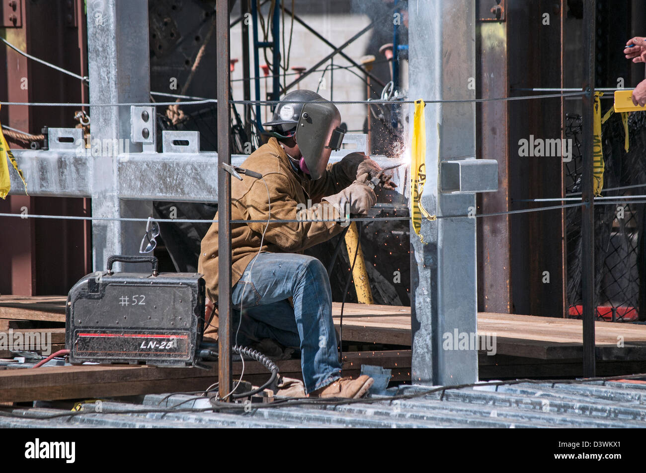 A welder working on a construction site Stock Photo - Alamy