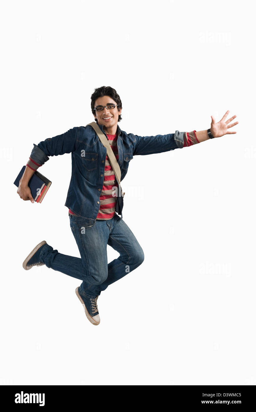 University student jumping in excitement Stock Photo - Alamy