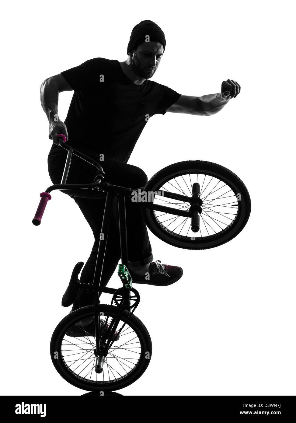 one man exercising bmx acrobatic figure in silhouette studio isolated ...
