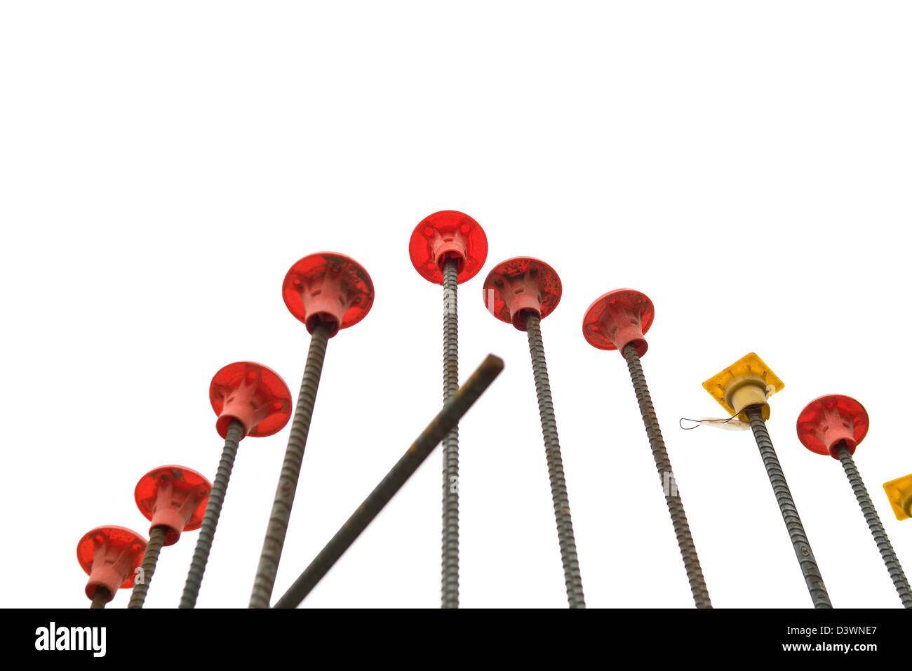 Concrete reinforcing steel with safety caps on a construction site ...