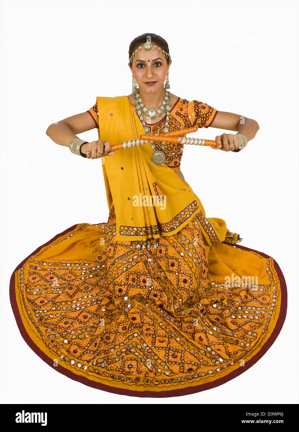 Woman performing dandiya Stock Photo - Alamy