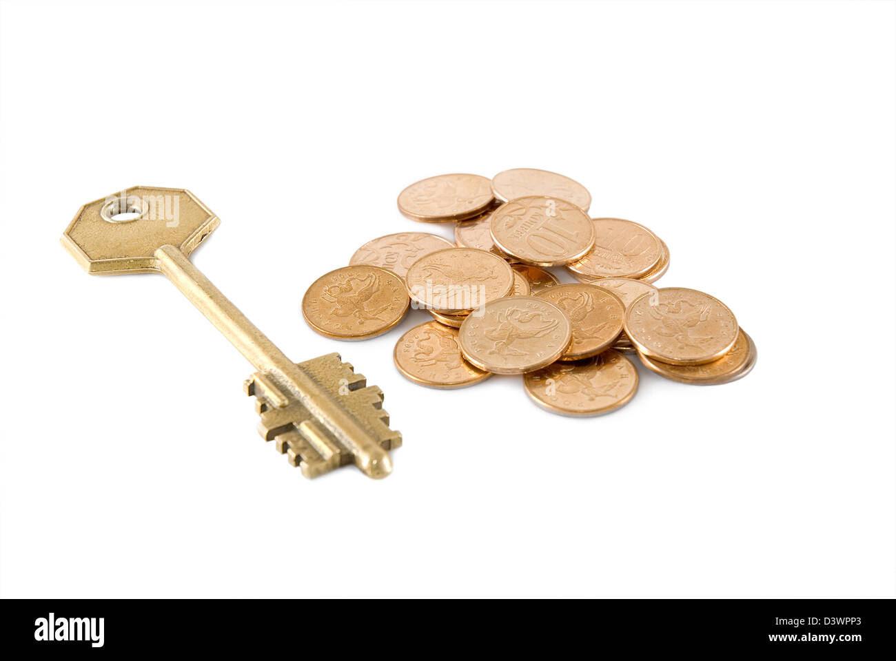 Coins and an ancient key are photographed on a white background Stock ...