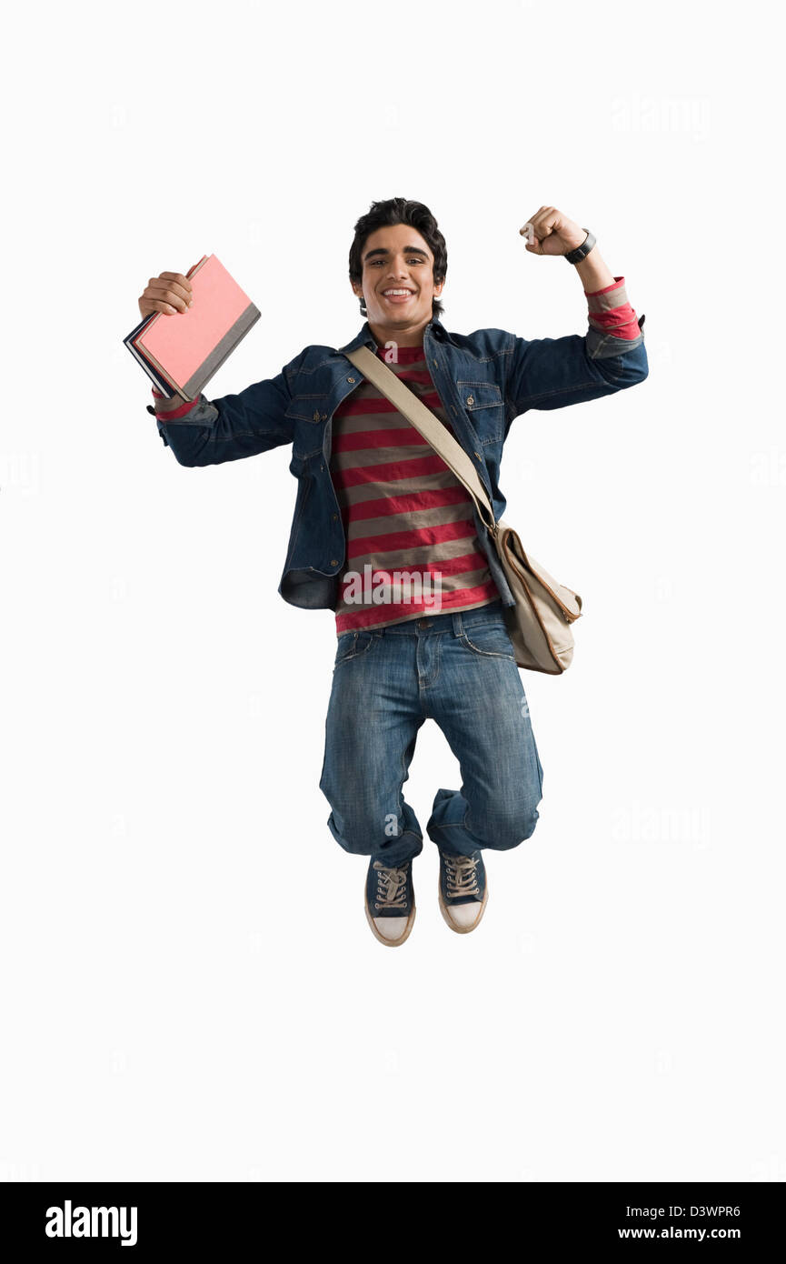 University student jumping in excitement Stock Photo - Alamy