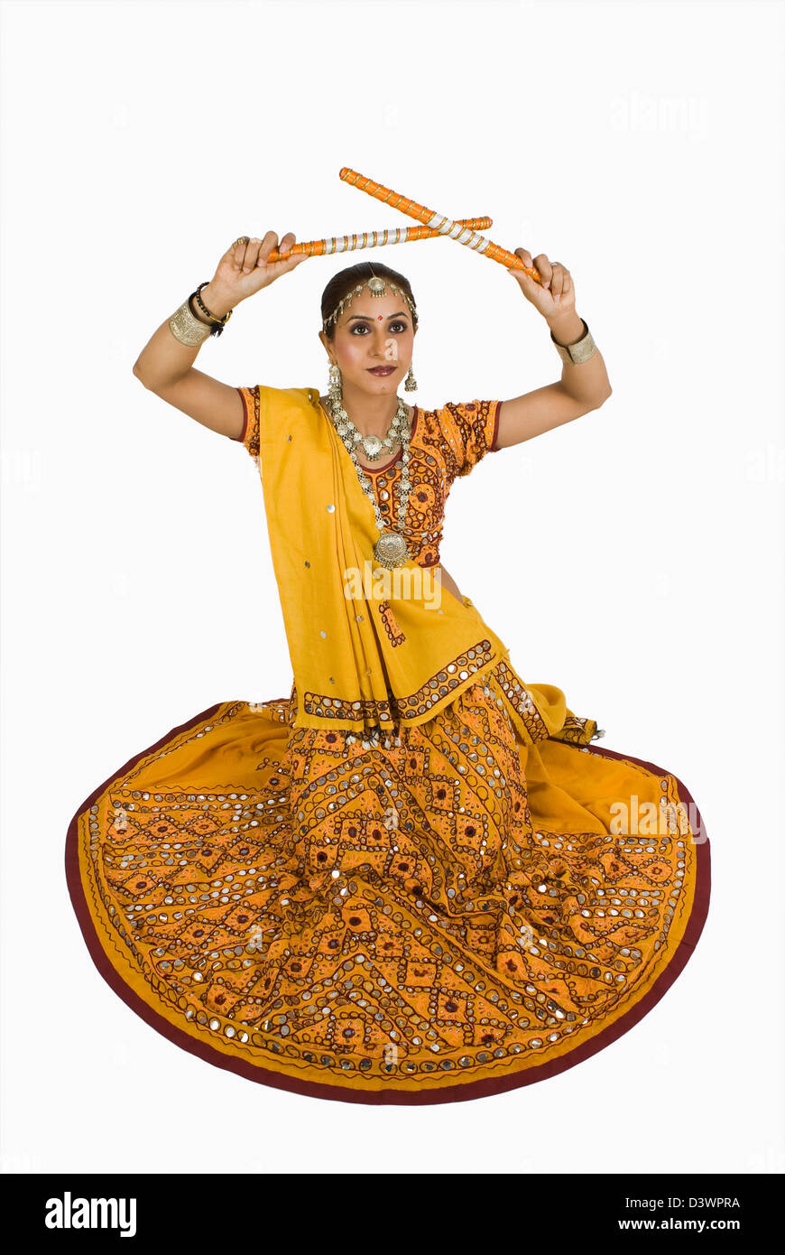 Woman performing dandiya Stock Photo - Alamy
