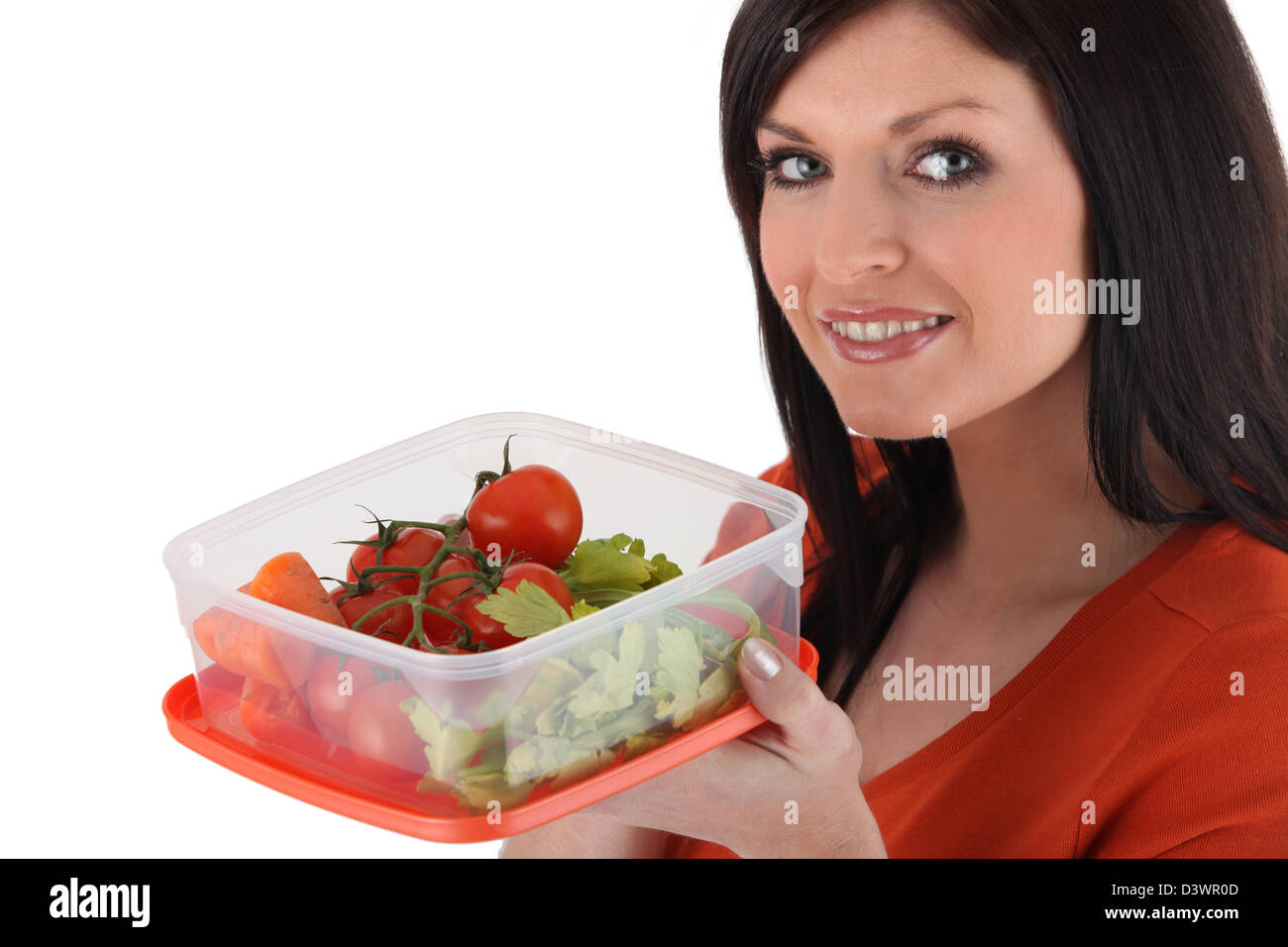 Woman eating a healthy snack Stock Photo - Alamy