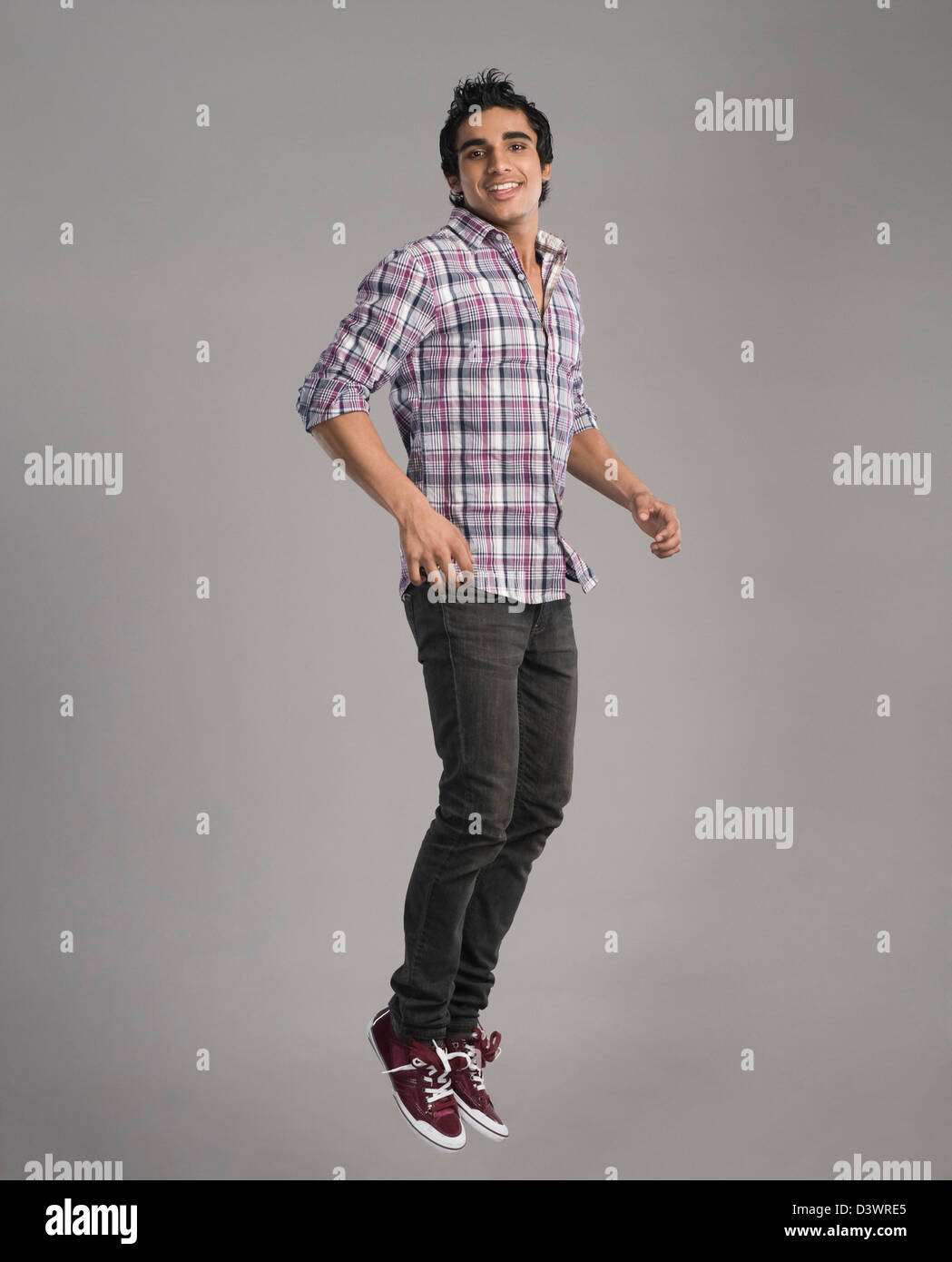 Portrait of a happy man jumping Stock Photo - Alamy