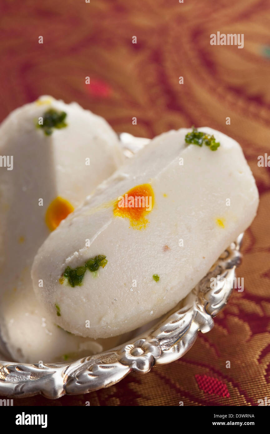 Close-up of cham cham a traditional Indian sweet made from chhena ...