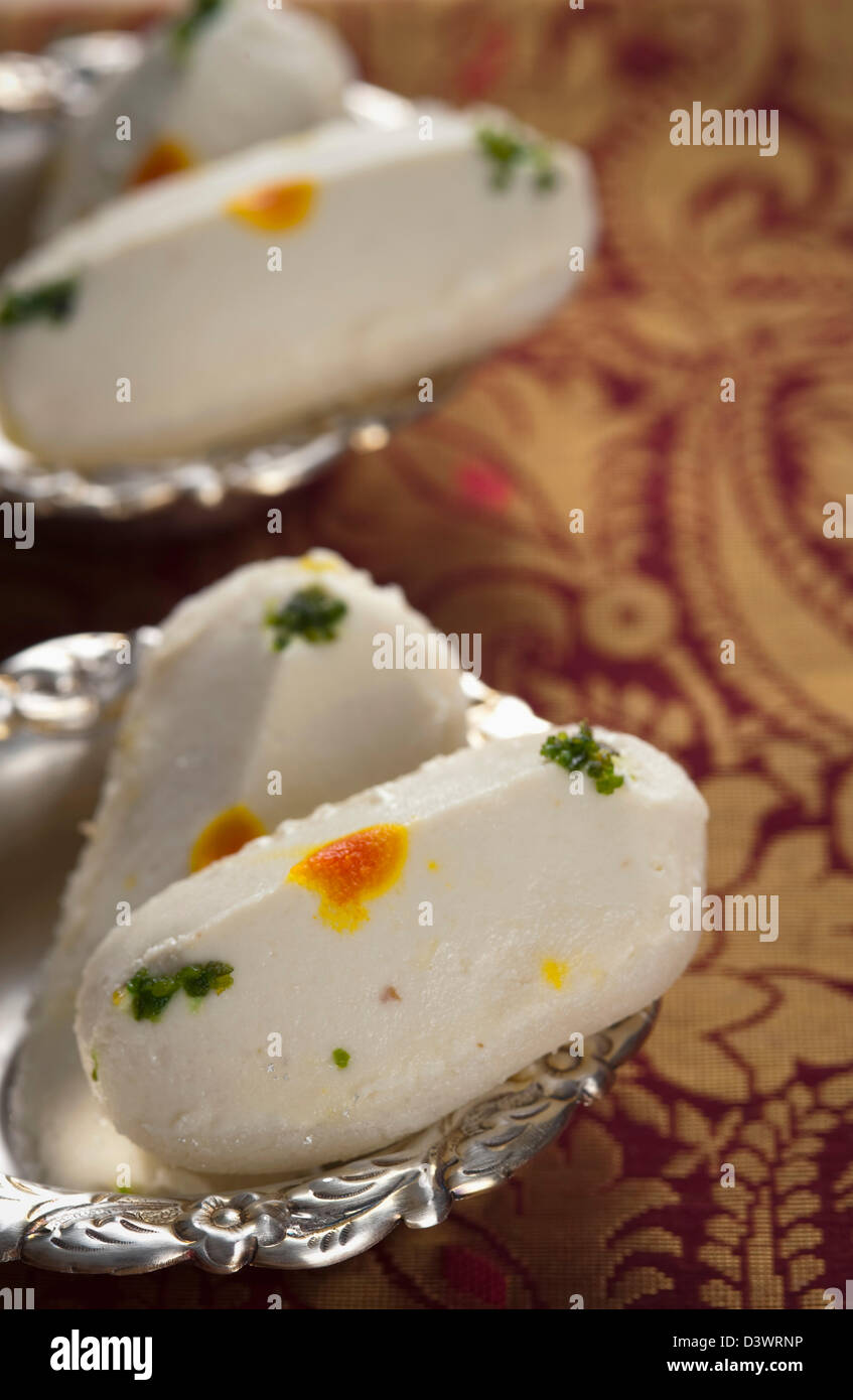 Close-up of cham cham a traditional Indian sweet made from chhena ...