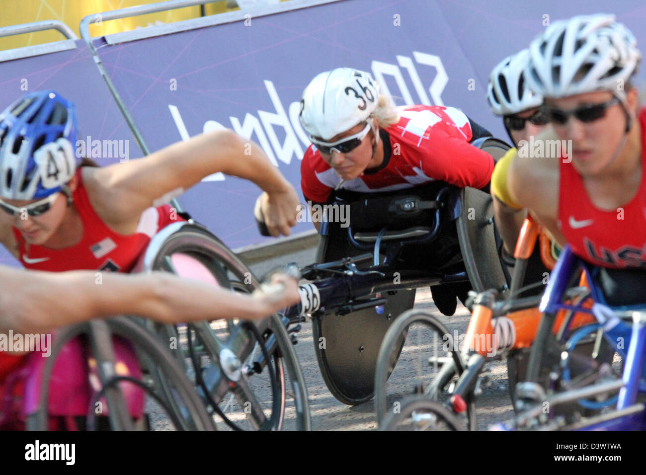 Edith Wolf of Switzerland (centre) in the womens wheelchair marathon ...