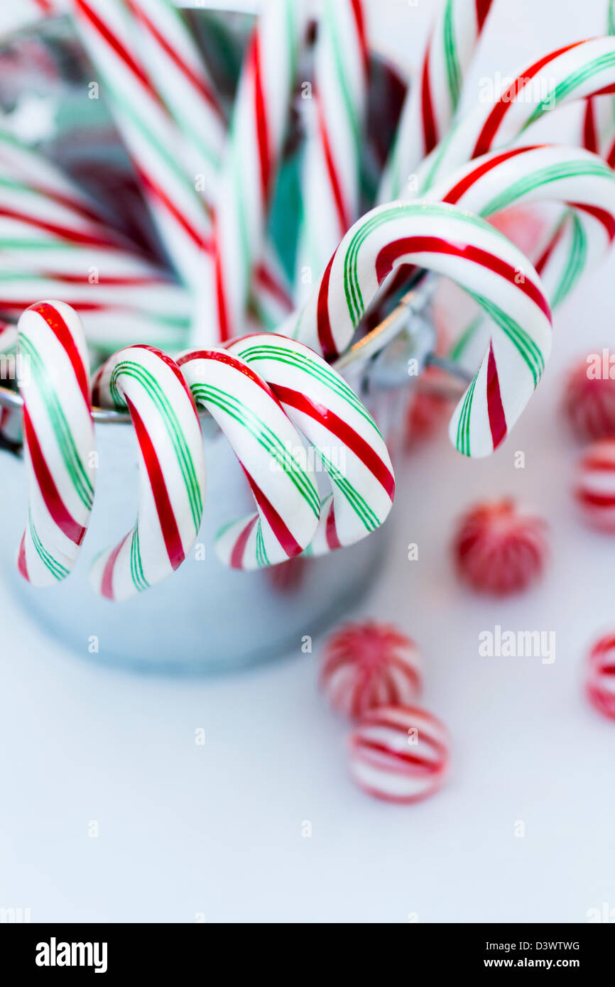 Peppermint candy canes on white background Stock Photo - Alamy