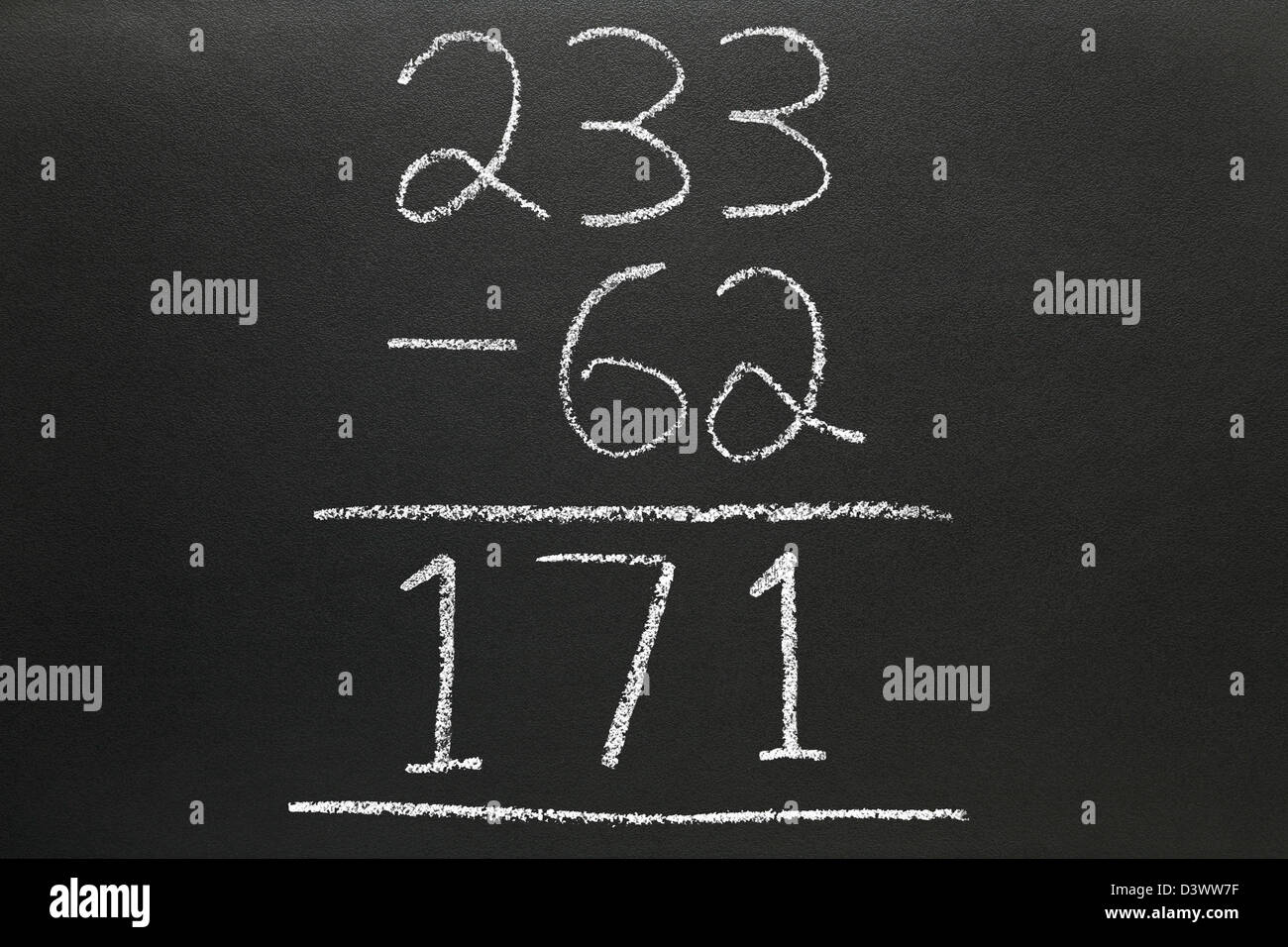A basic subtraction sum written on a blackboard Stock Photo - Alamy