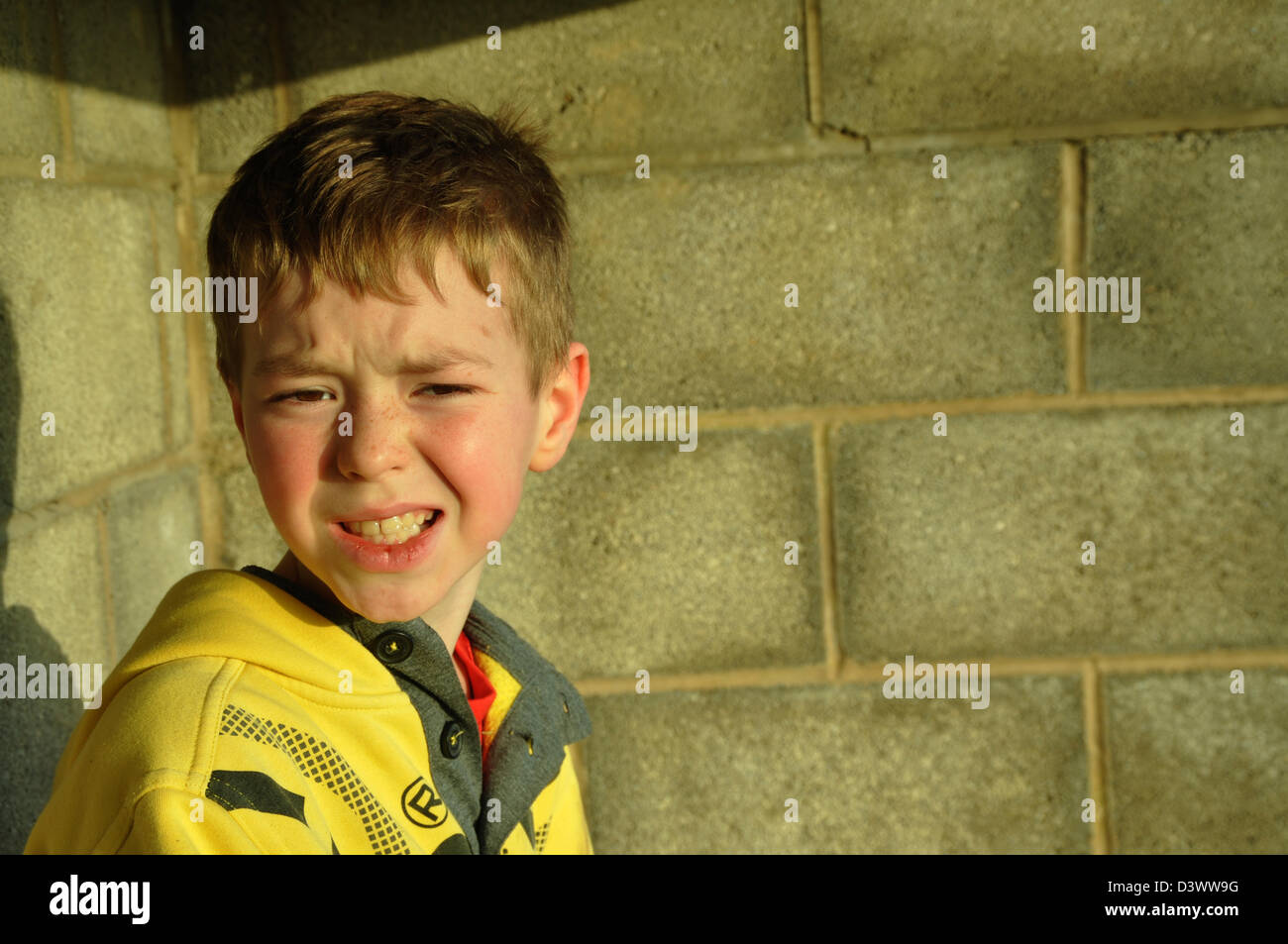 Child smiling in the bright sunshine Stock Photo - Alamy