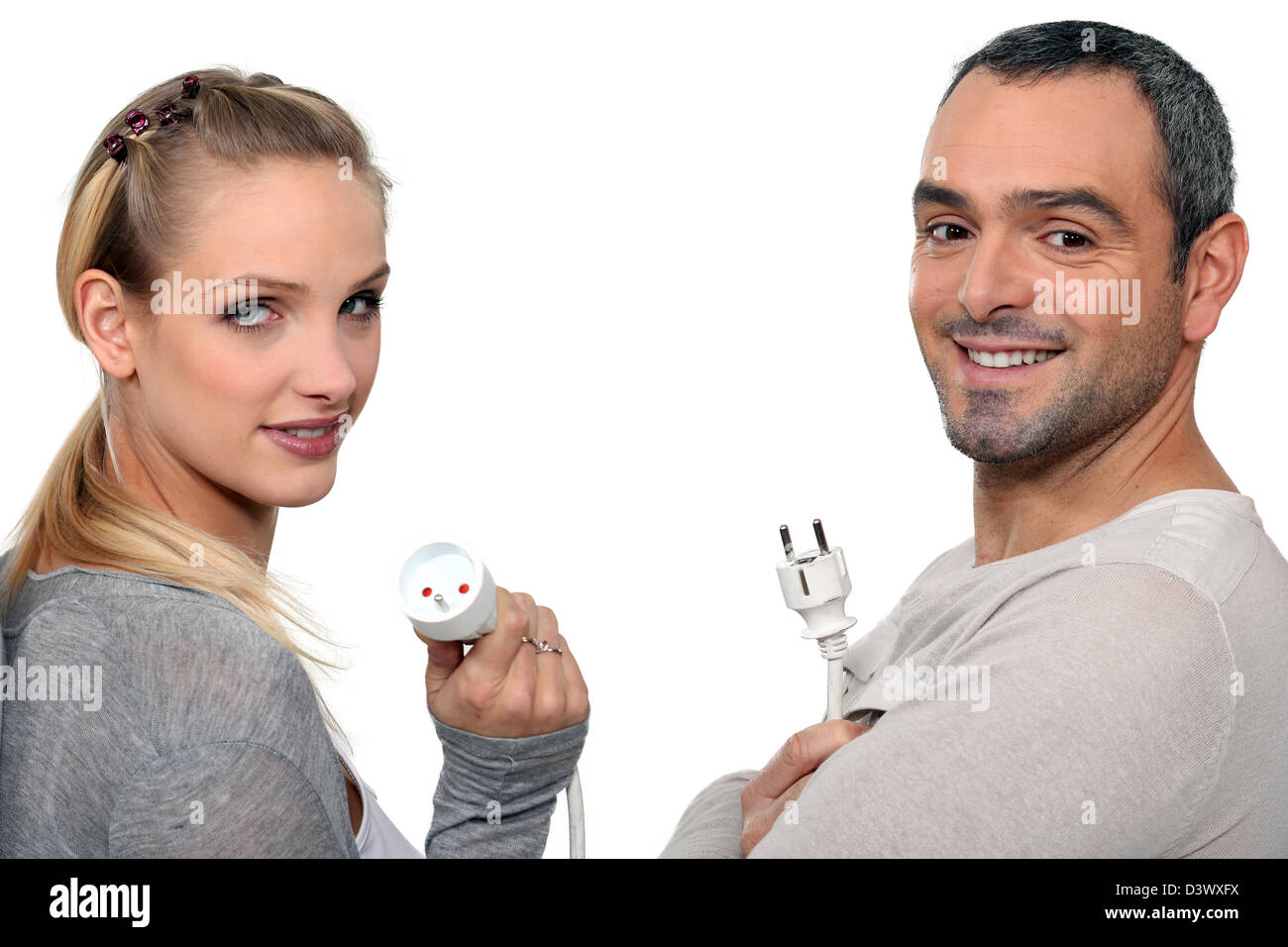 Couple holding electrical cable Stock Photo - Alamy