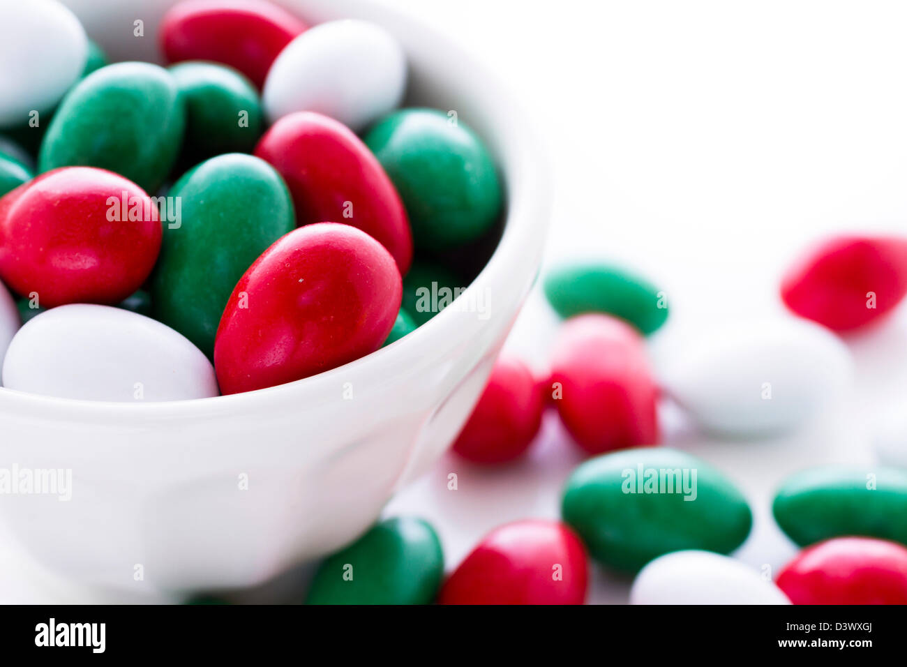 Colorful red, green and white candies on white background Stock Photo ...
