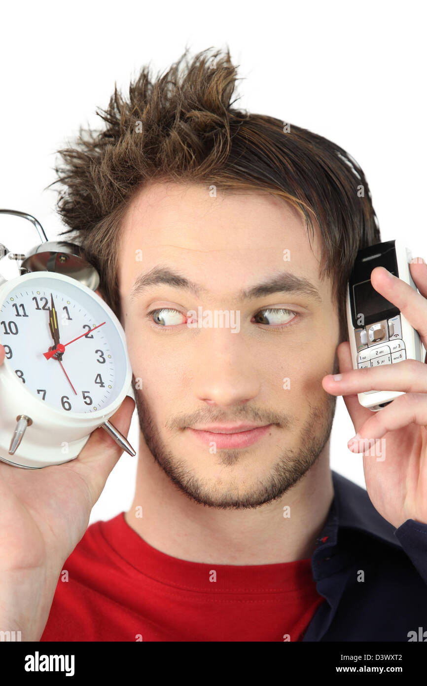 Girl with telephone and alarm clock Stock Photo - Alamy